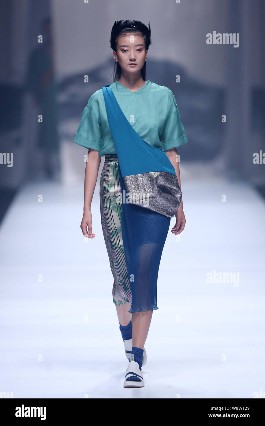 A model displays a new creation at the fashion show of Ji Cheng during ...