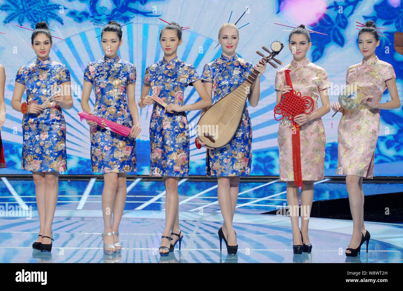 Chinese and foreign models display creations of cheongsam, also known ...