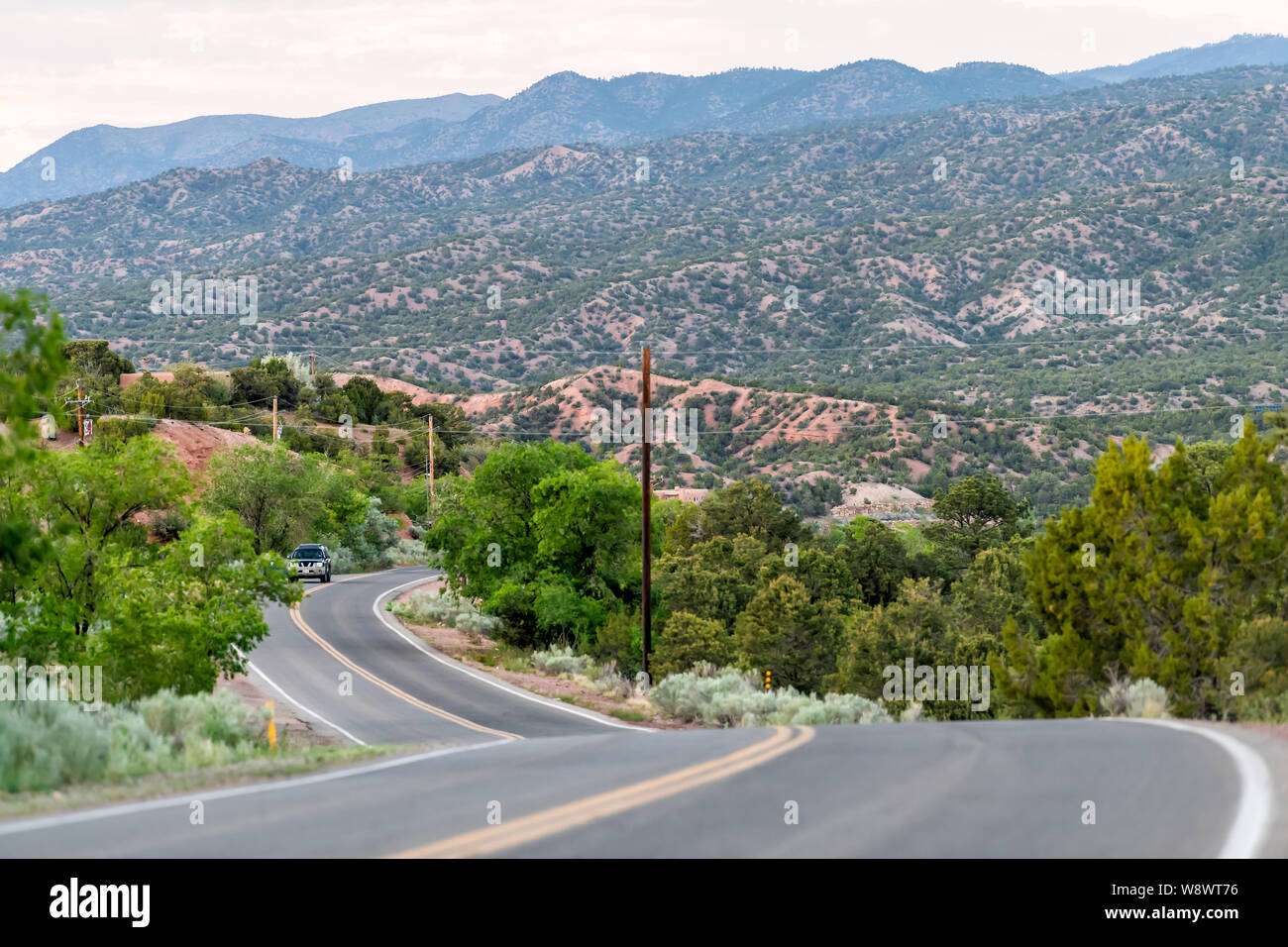 Sunset on Bishops Lodge Road street in Santa Fe, New Mexico with pink ...