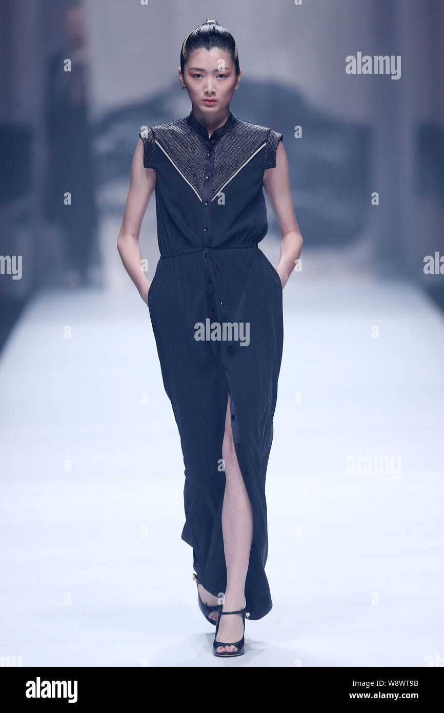 A model displays a new creation at the fashion show of Ji Cheng during ...