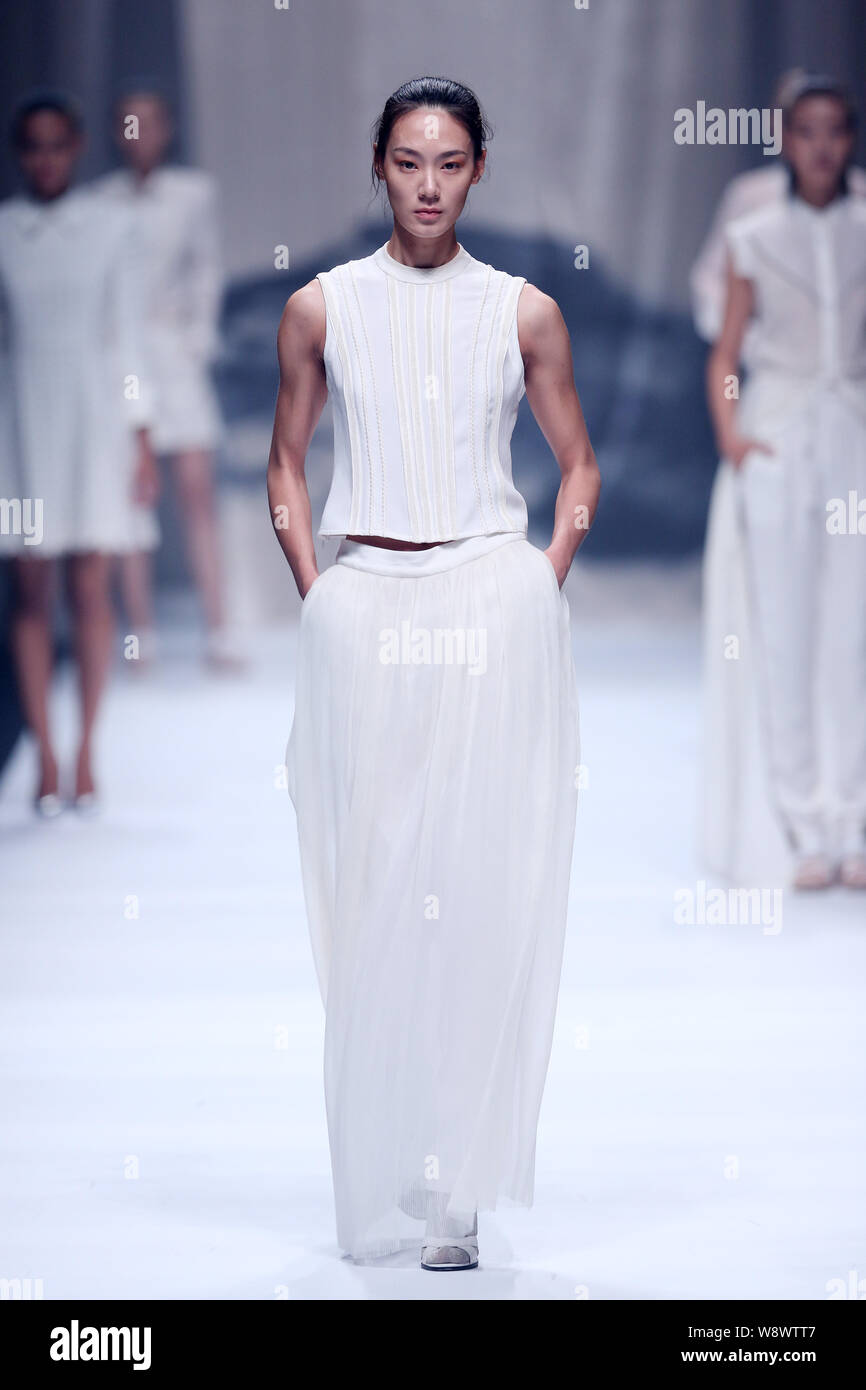 A model displays a new creation at the fashion show of Ji Cheng during ...