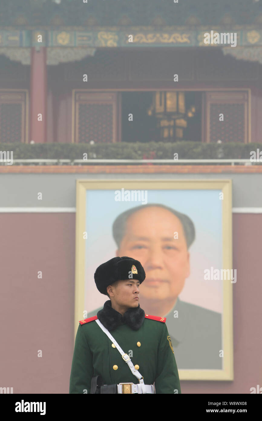 --FILE--A paramilitary policeman stands guard in front of the Tiananmen ...
