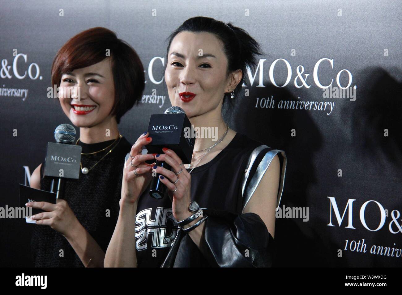 Hong Kong actress Maggie Cheung, right, speaks at a fashion event for ...