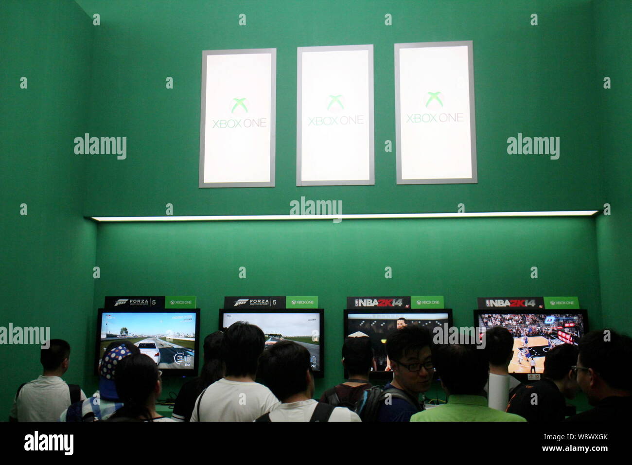 --FILE--Visitors play electronic games on Microsoft's Xbox One game ...