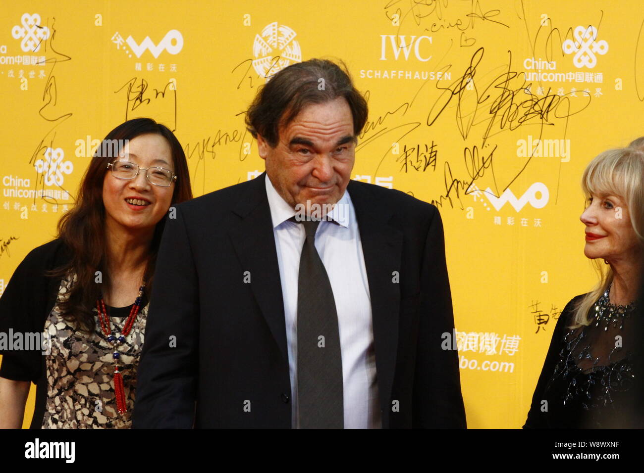 American film director William Oliver Stone, center, poses on the red ...