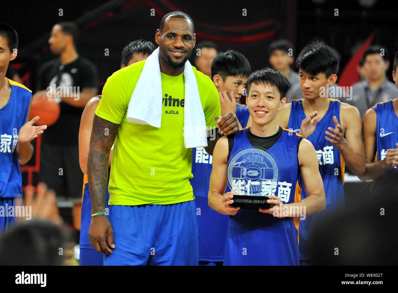 NBA superstar LeBron James, left, poses with a Chinese fan at a fan ...
