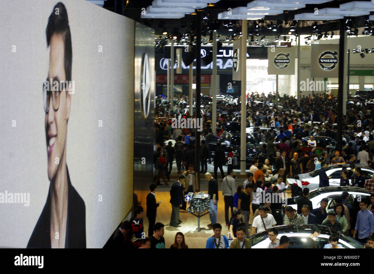 Visitors crowd the stand of Volvo during the 13th Beijing International ...