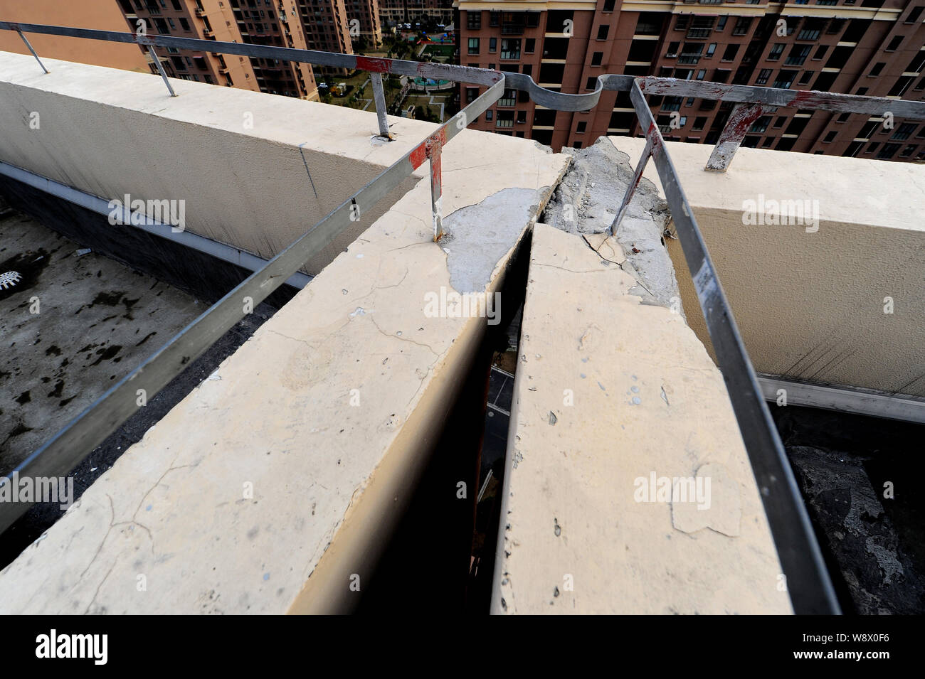 The two apartment buildings bump into each other on the eaves at the ...
