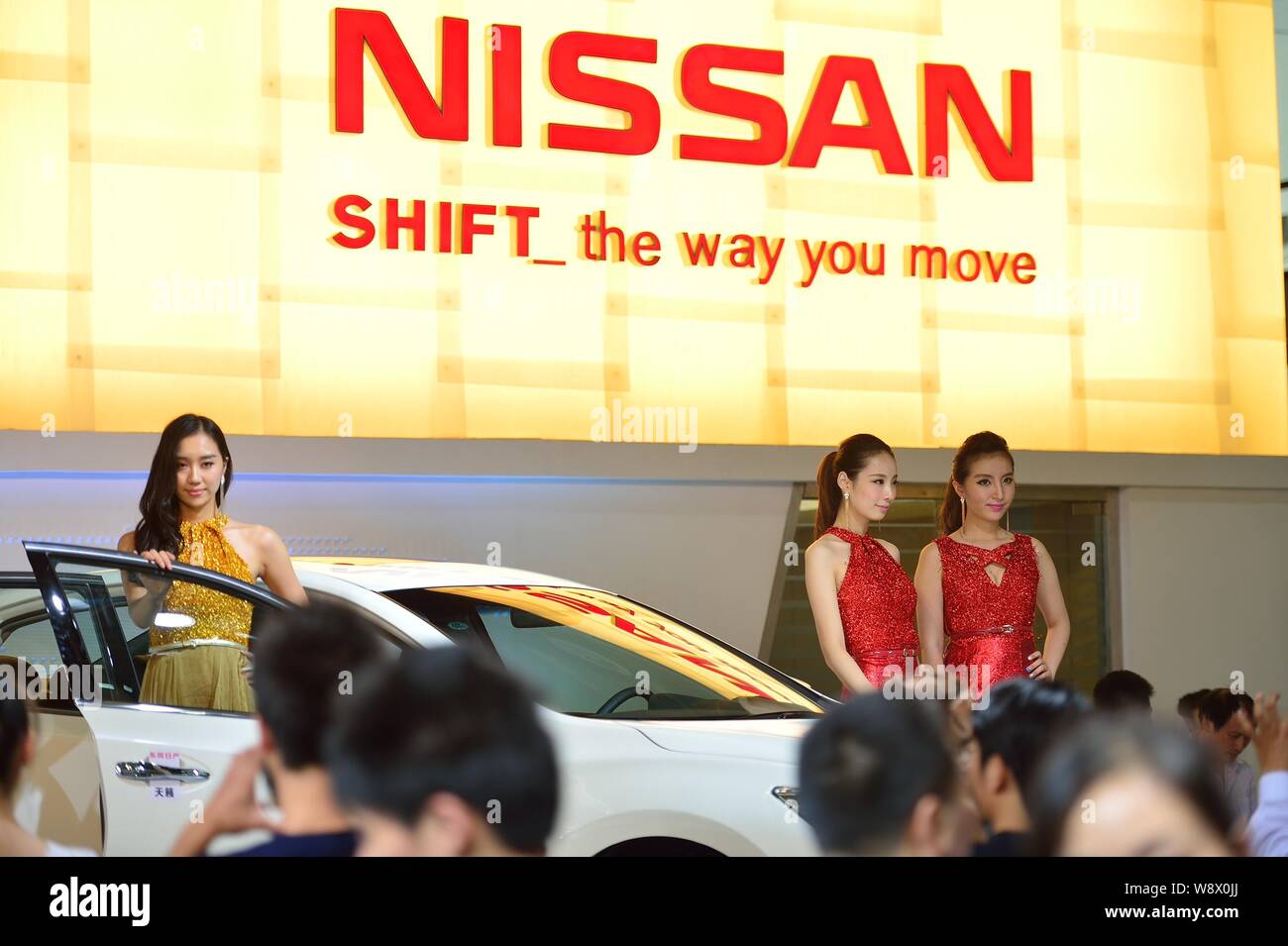 --FILE--People visit the stand of Nissan during an automobile ...