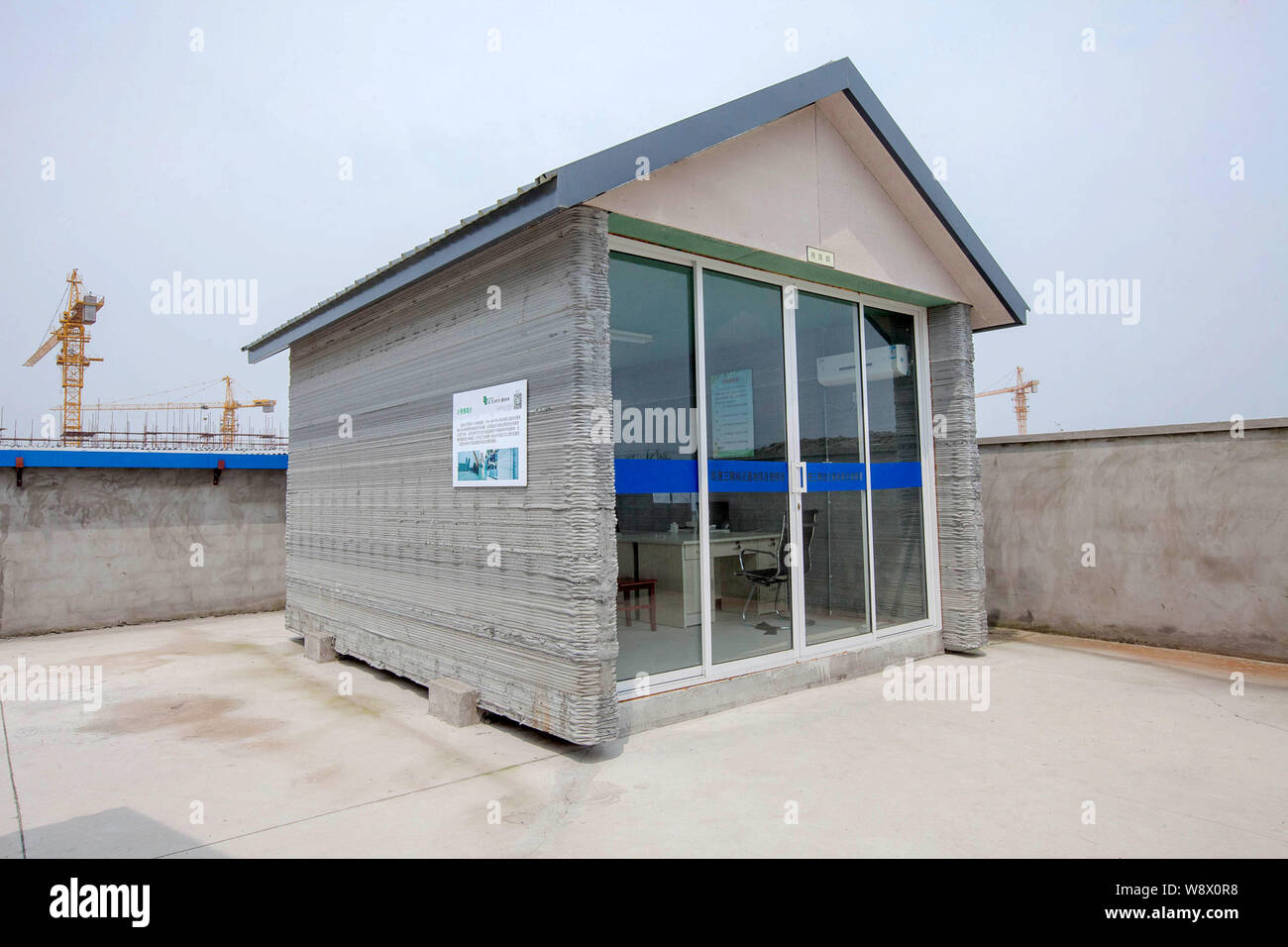 One of the ten 3D printed houses is pictured at the Qingpu Park of the ...