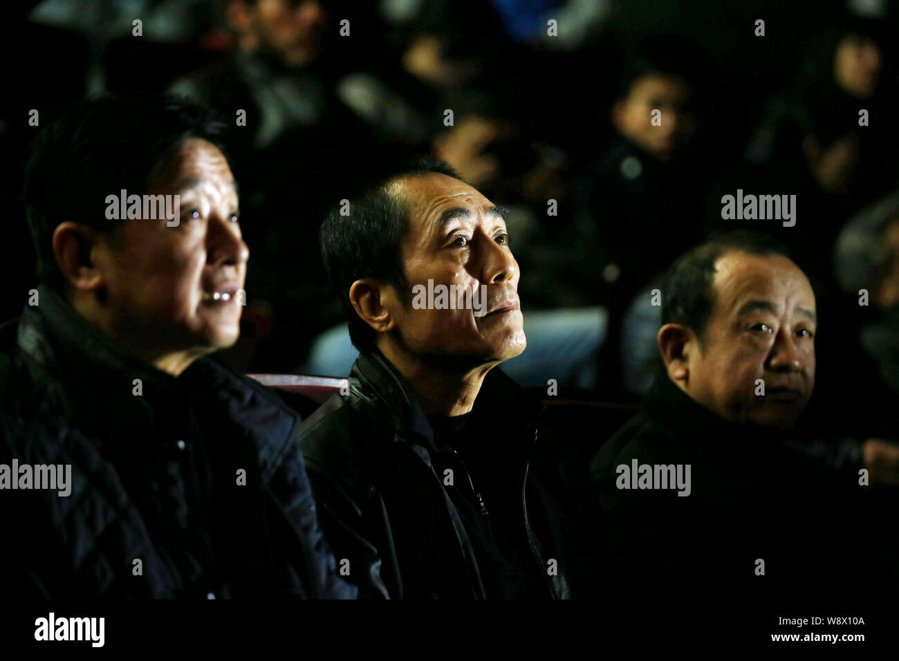 Chinese director Zhang Yimou, center, attends a memorial meeting for ...