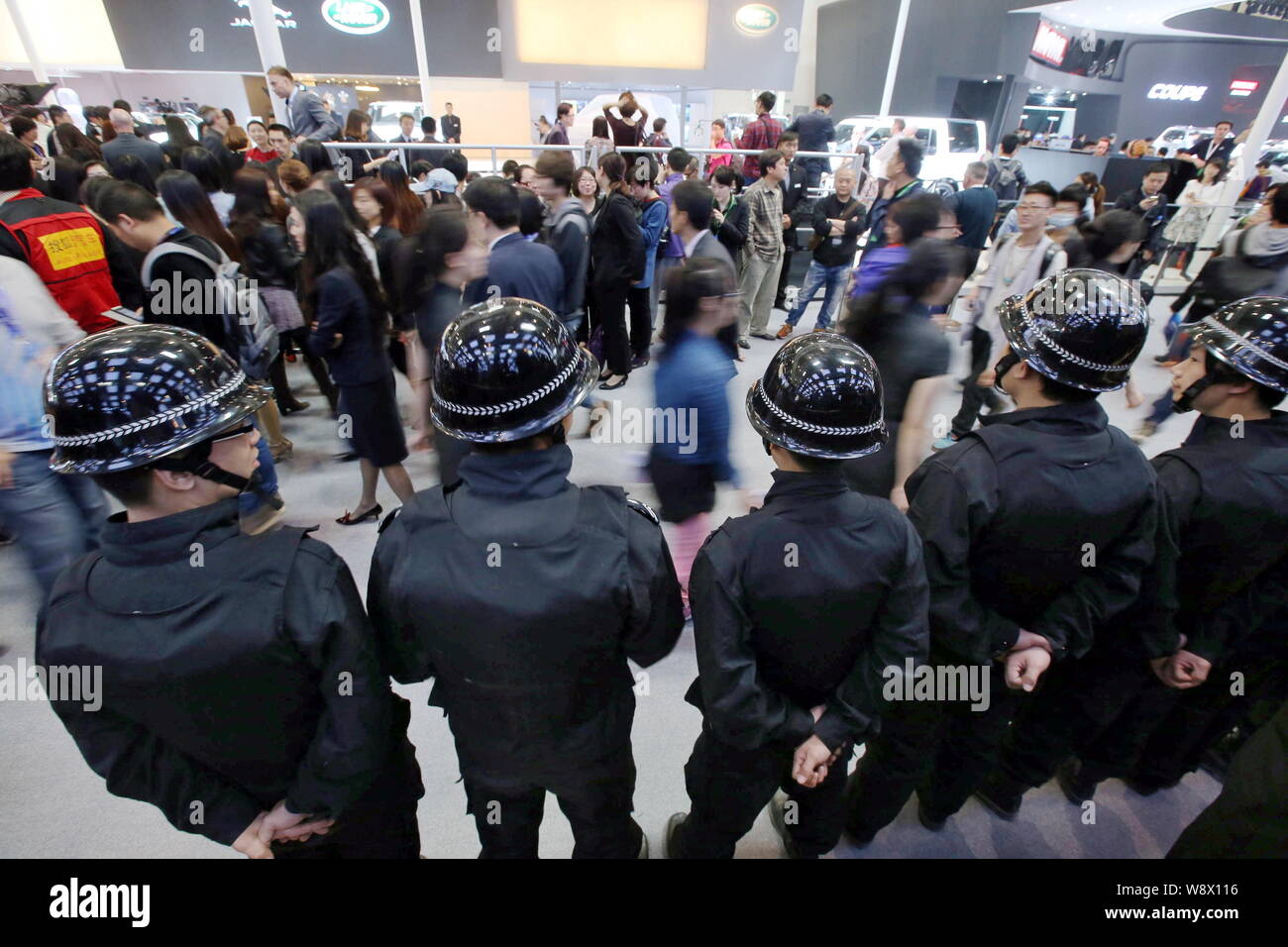 Chinese security guards line up front of the stand of Land Rover during ...