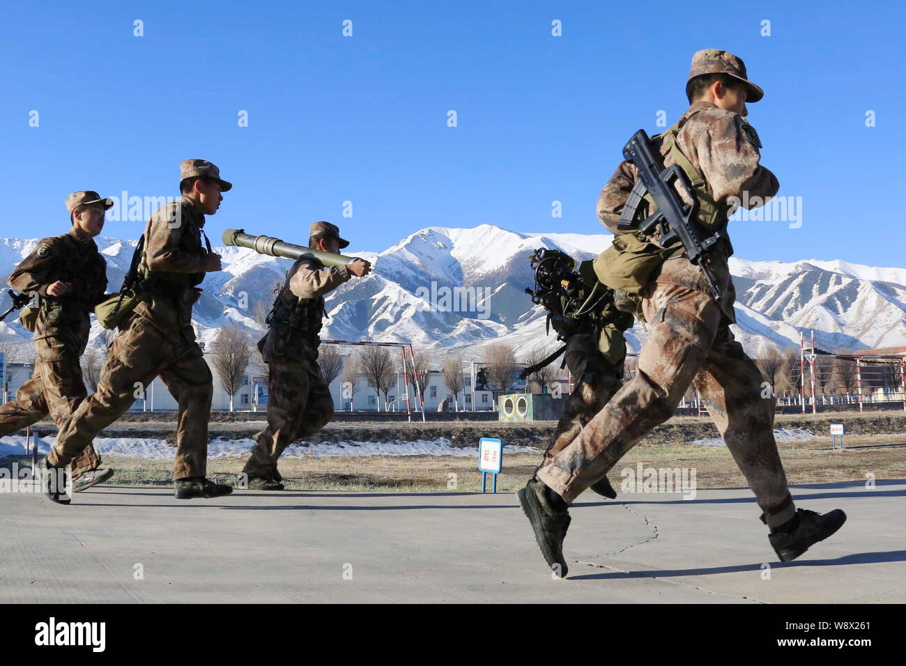 --FILE--Armed Chinese PLA (People's Liberation Army) take part in a ...