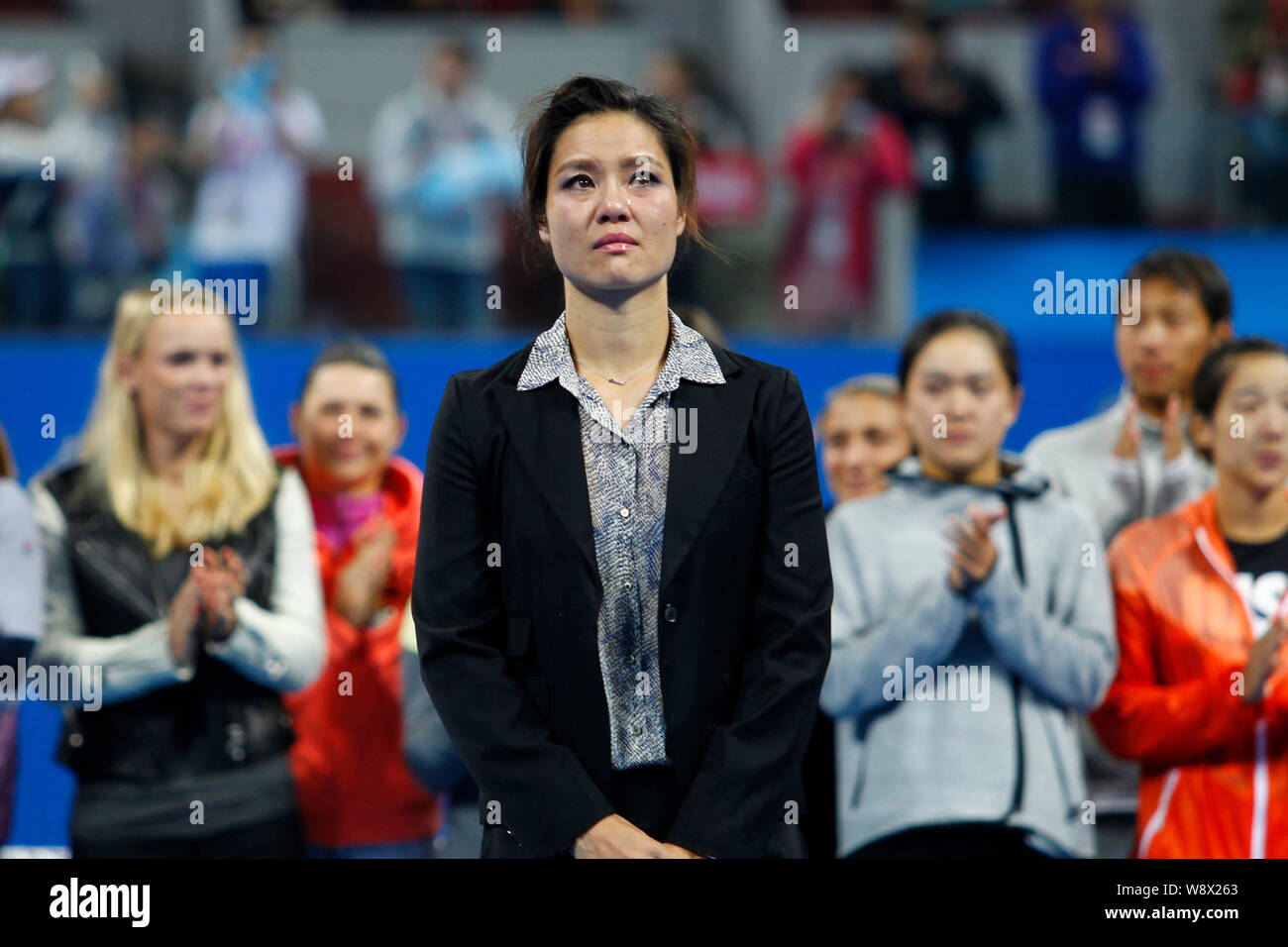 Chinese tennis player Li Na cries during her retirement ceremony at the ...