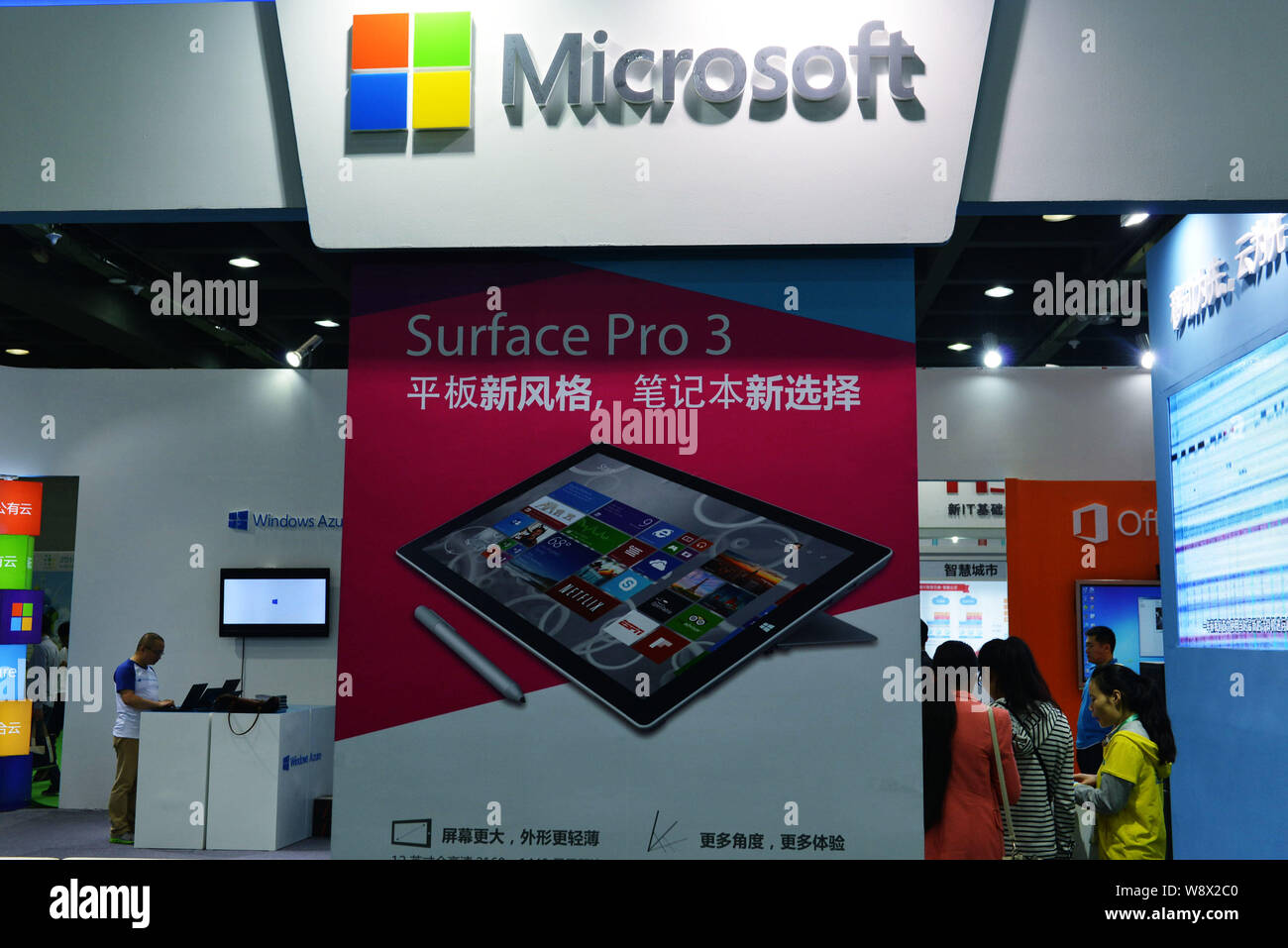 Chinese customers try out Surface Pro 3 tablet PCs at a store of ...