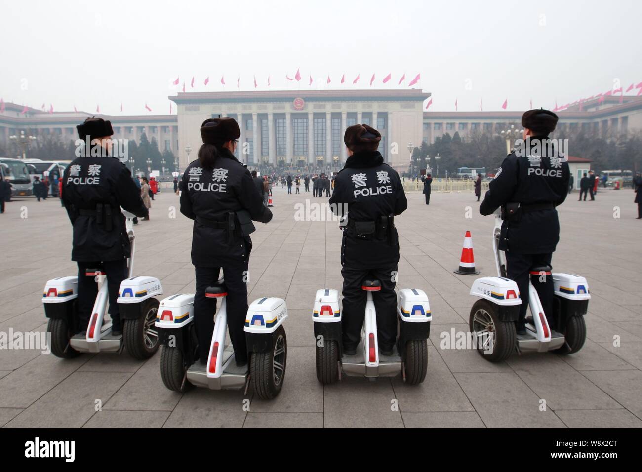 Chinese police officers ride Segway-like two-wheeled electric vehicles ...
