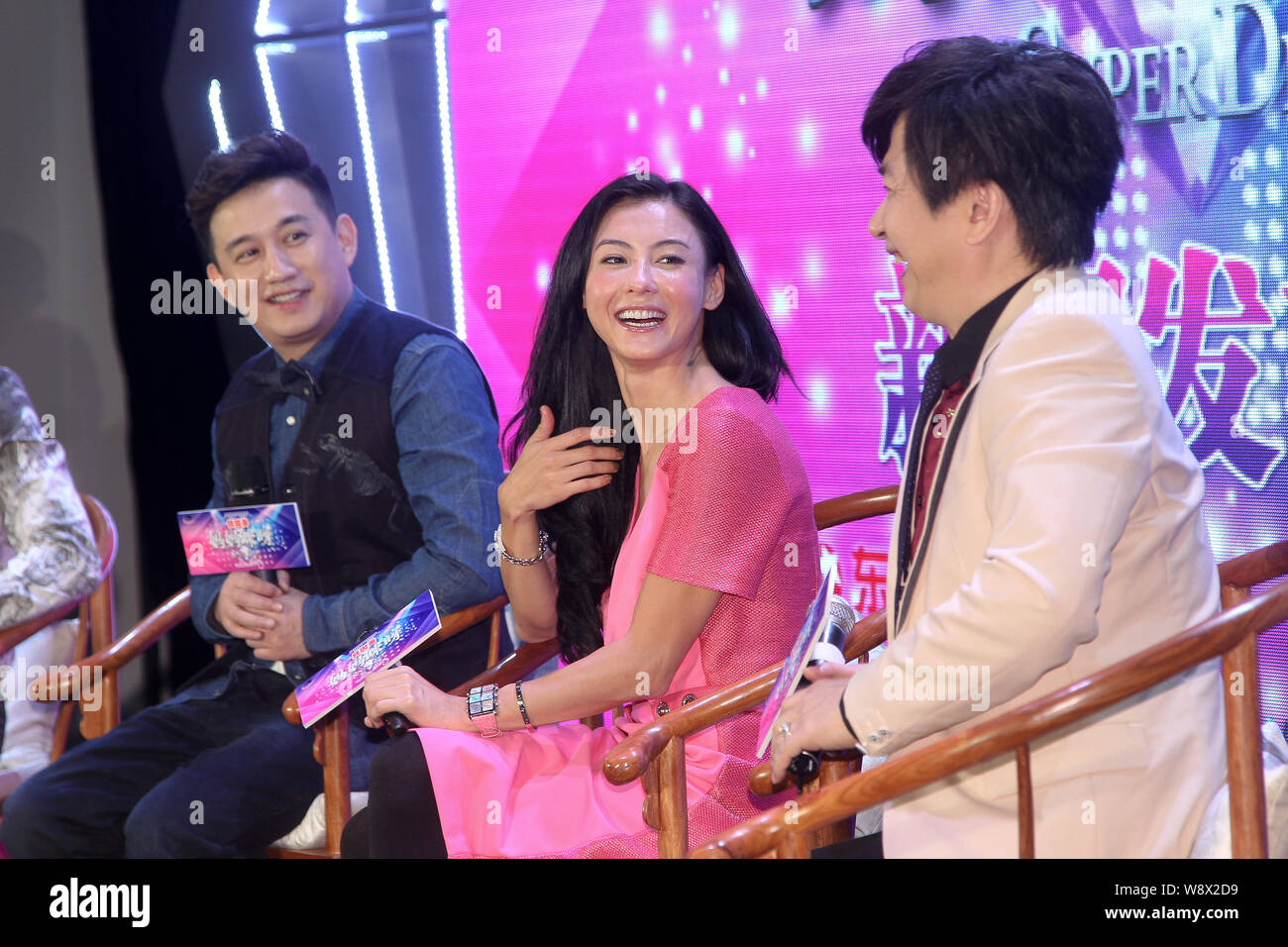 Hong Kong singer and actress Cecilia Cheung, center, laughs next to ...