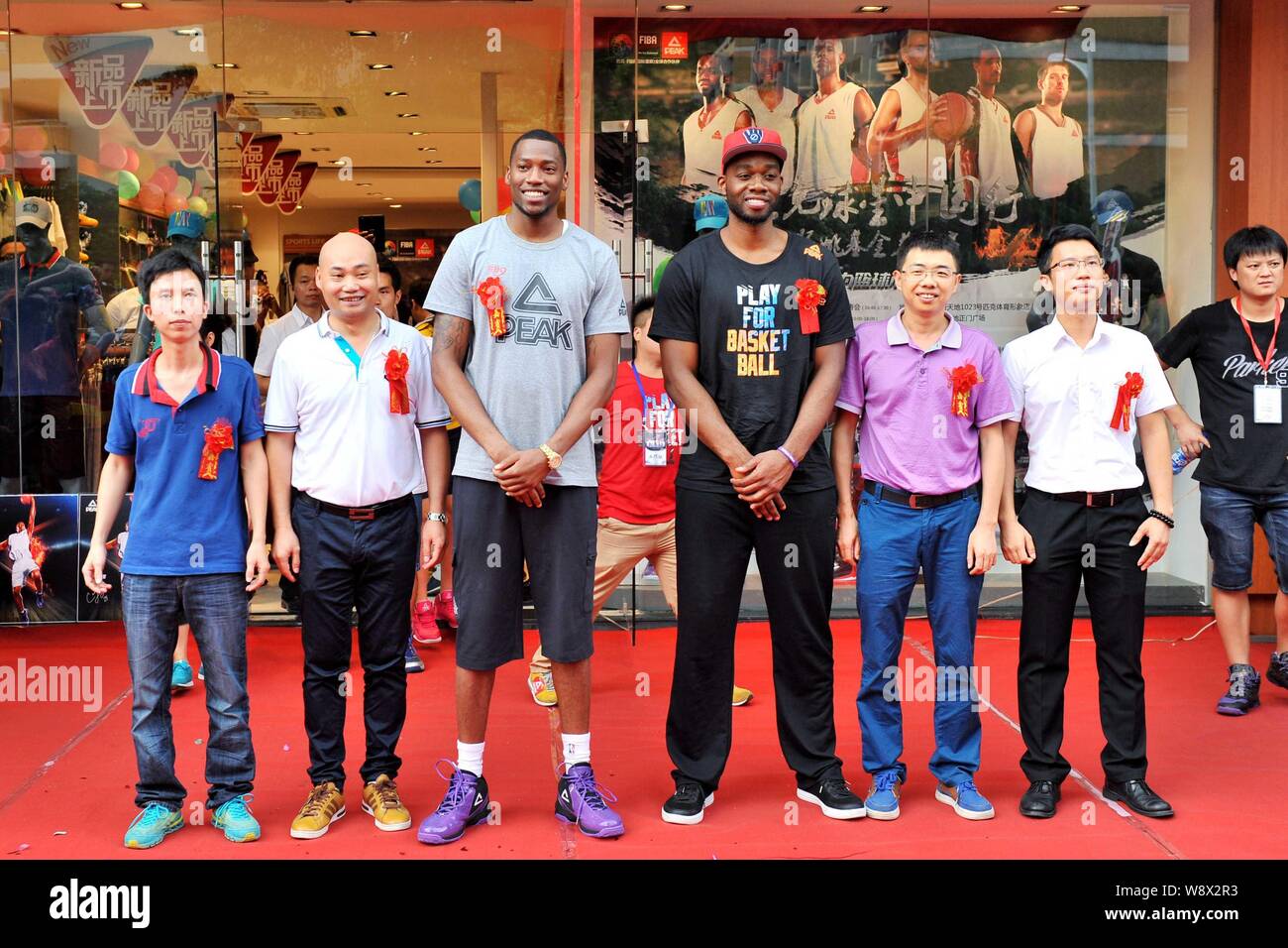 American basketball players Marcus Landry, fourth right, and Eric ...