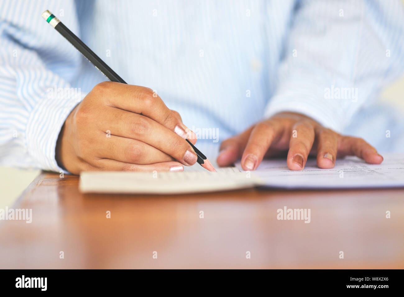 take the exam final high school university student holding pencil ...
