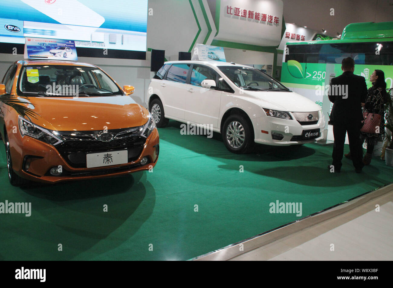 --FILE--A BYD Qin and a BYD e6 electric cars are displayed during an ...