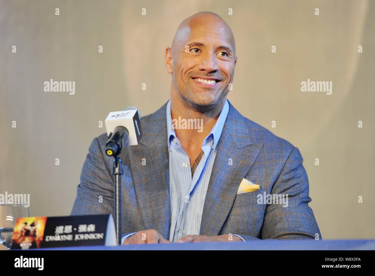 American actor Dwayne Johnson smiles during a press conference for his ...