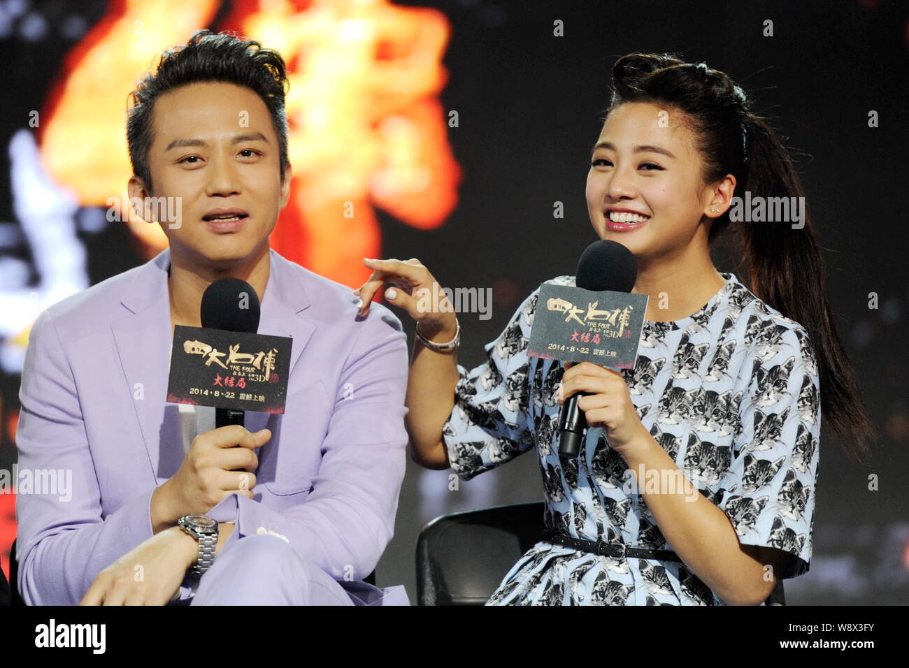 Chinese actor Deng Chao, left, and actress Wu Yingjie speak during a press conference for the ...
