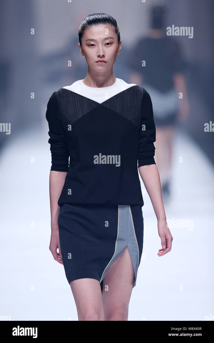A model displays a new creation at the fashion show of Ji Cheng during ...