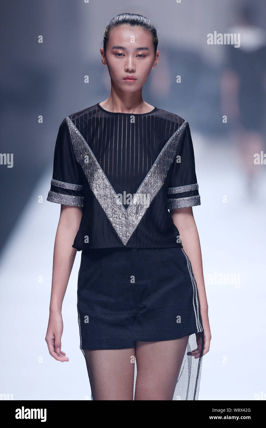 A model displays a new creation at the fashion show of Ji Cheng during ...