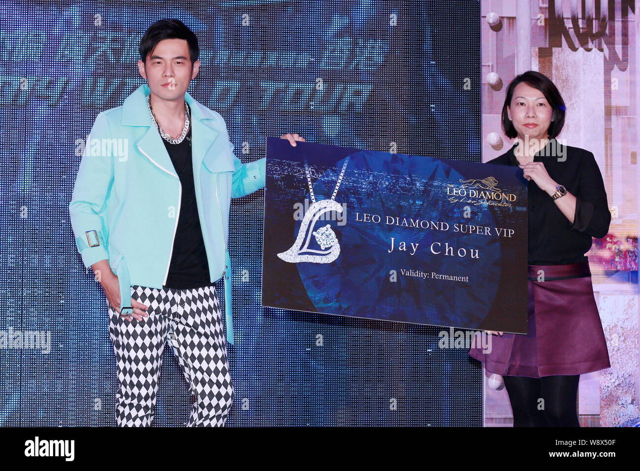 Taiwanese singer Jay Chou, left, poses at a press conference for the ...