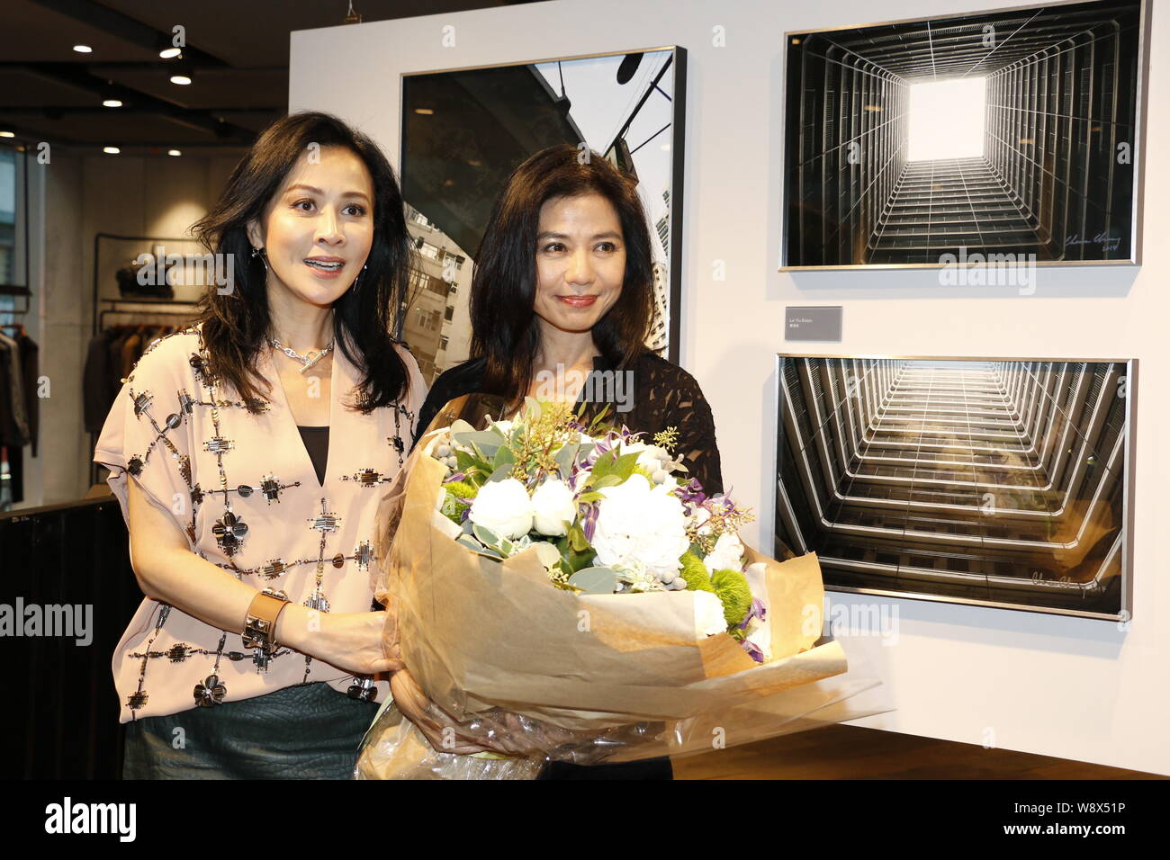 Hong Kong actresses Carina Lau, left, and Cherie Chung pose during ...