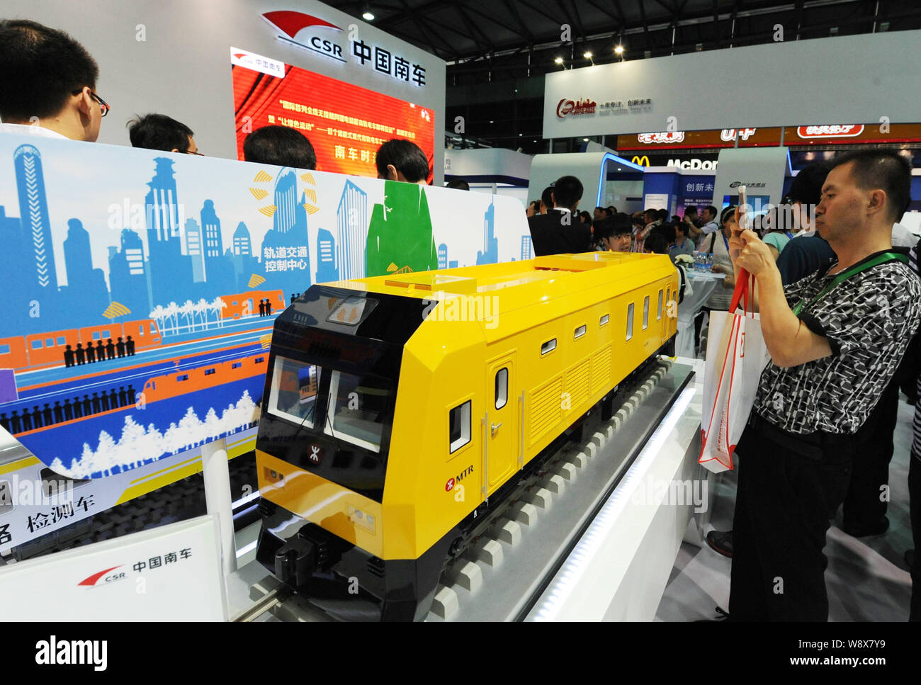 --FILE--People visit the stand of CSR (China South Locomotive & Rolling ...