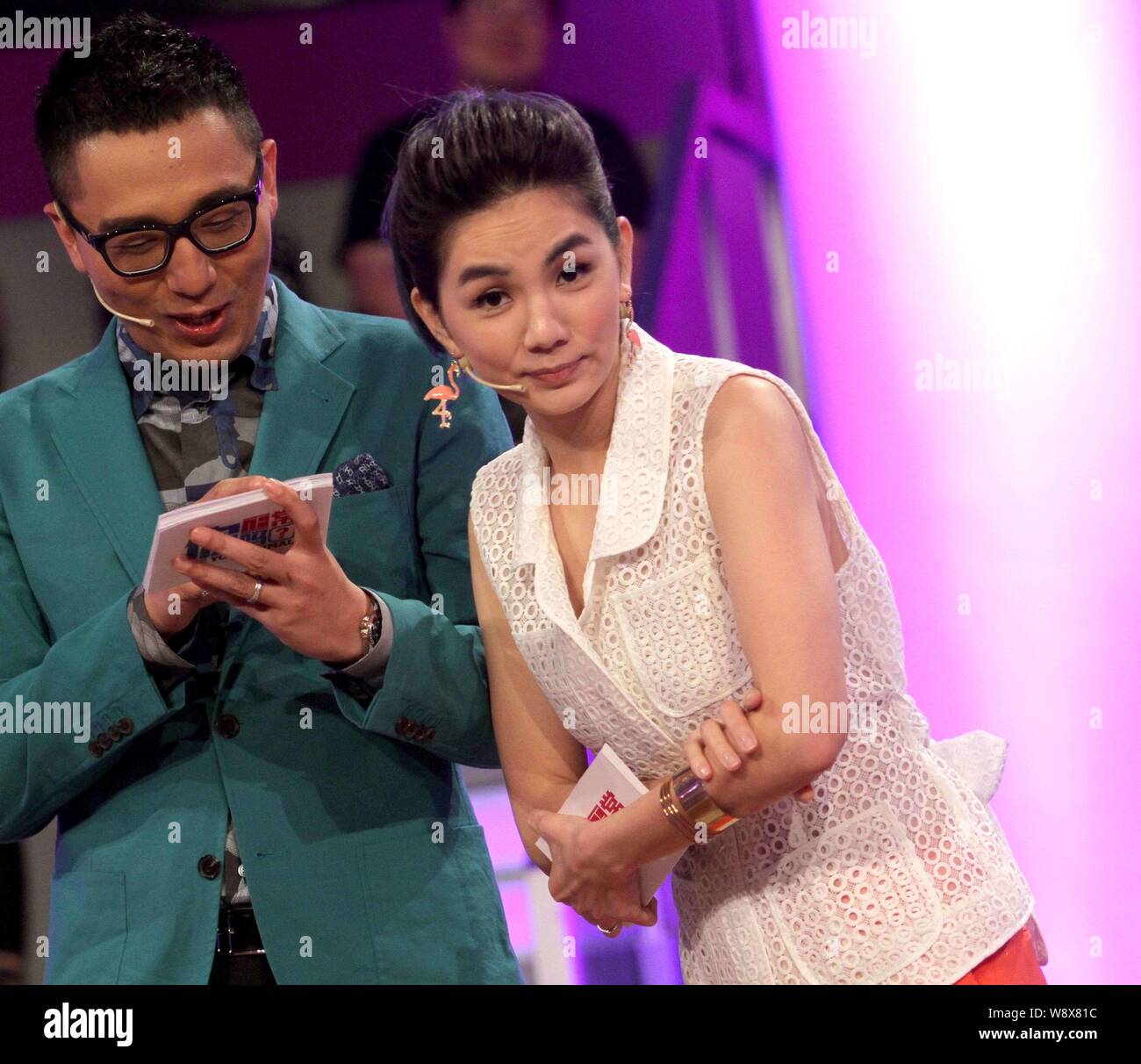 Taiwanese singer Ella Chen of pop girl group S.H.E, right, poses next ...