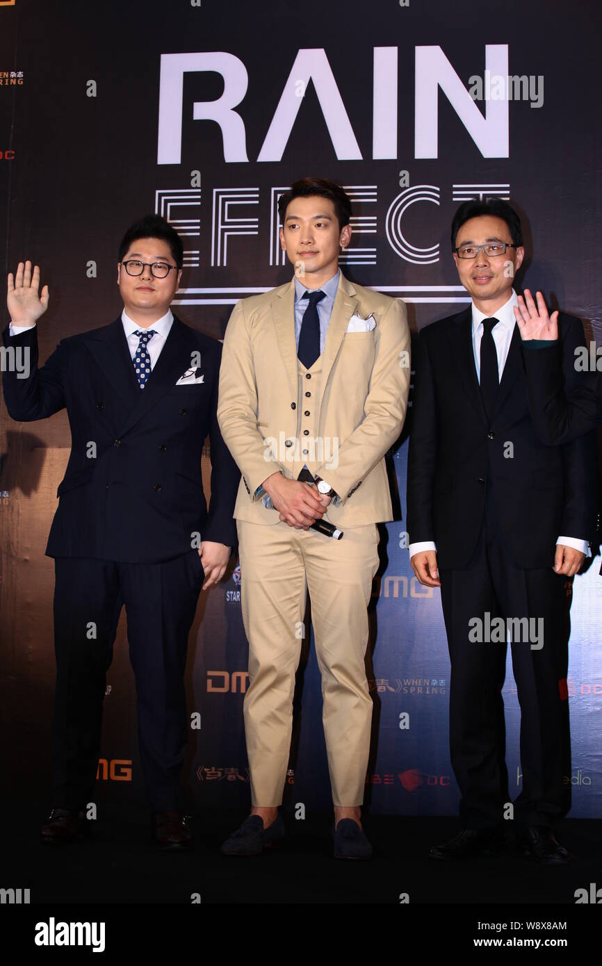 South Korean singer and actor Rain, center, poses at a press conference ...