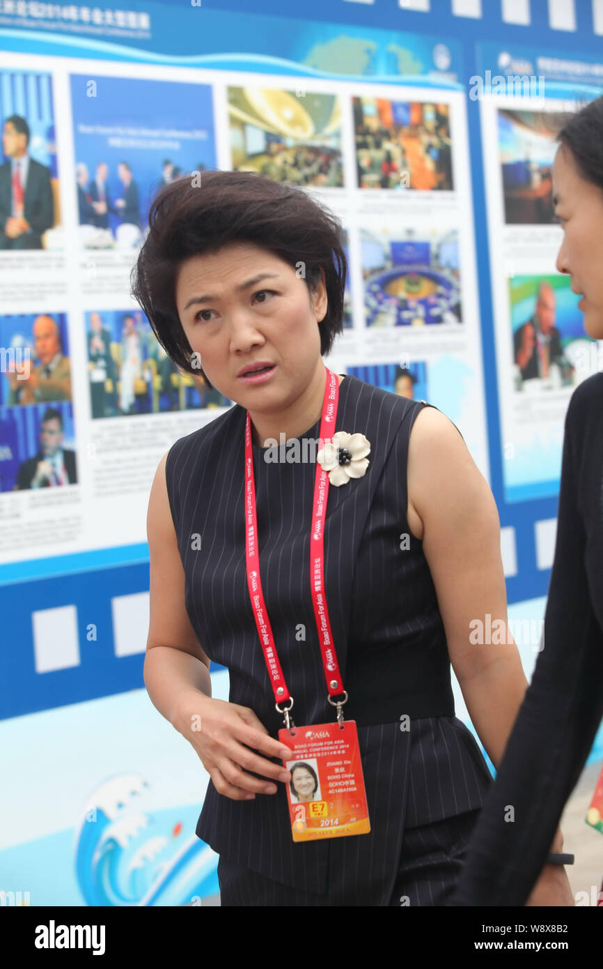 --FILE--Zhang Xin, left, co-founder and co-CEO of SOHO China, arrives ...