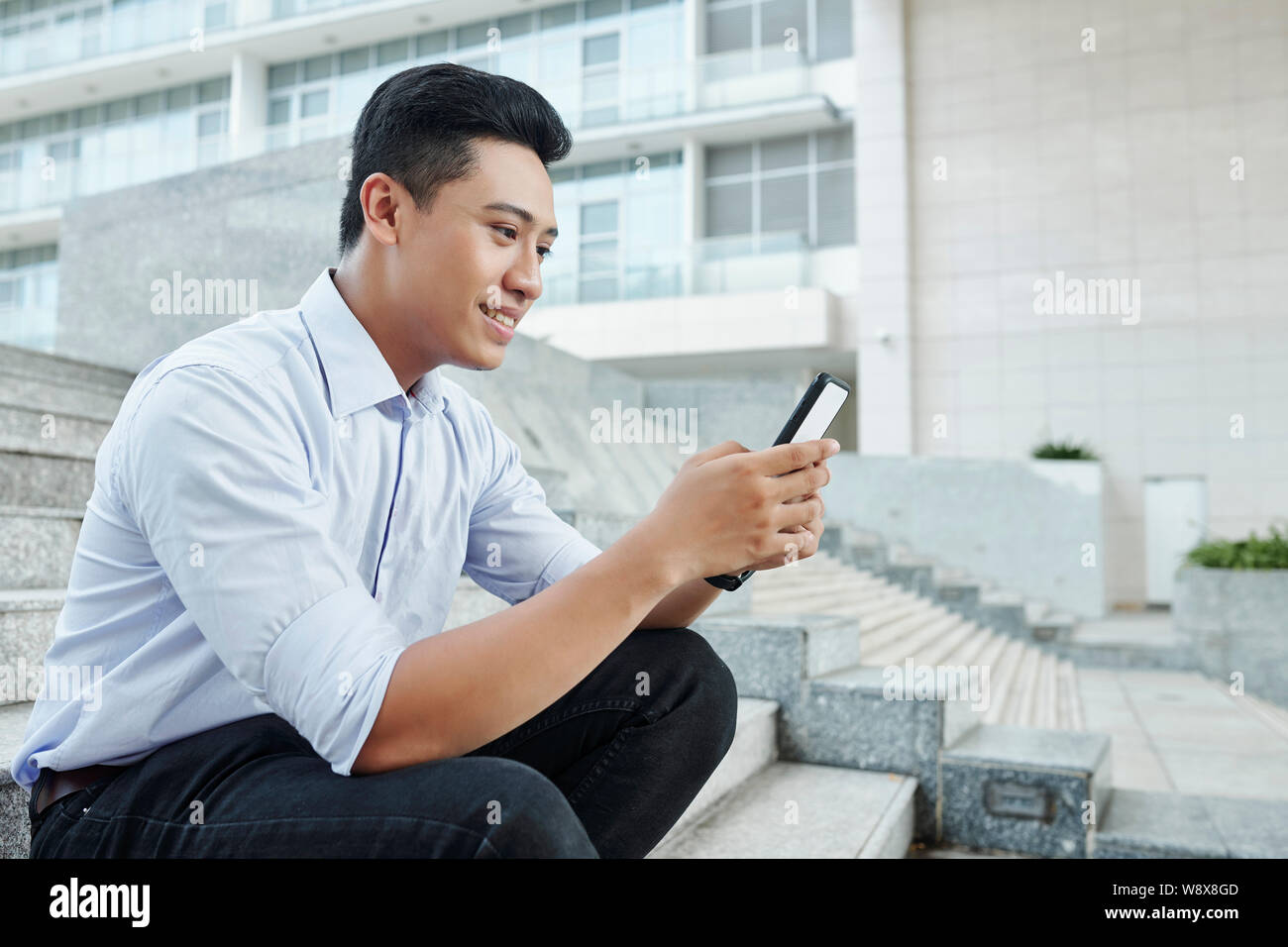 Businessman checking messages hi-res stock photography and images - Alamy
