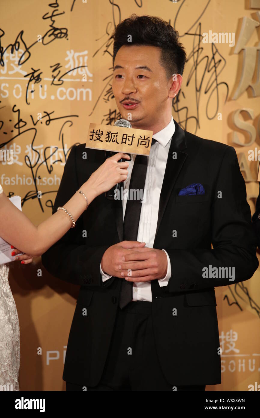 --FILE--Chinese actor Huang Haibo is interviewed on the red carpet as ...