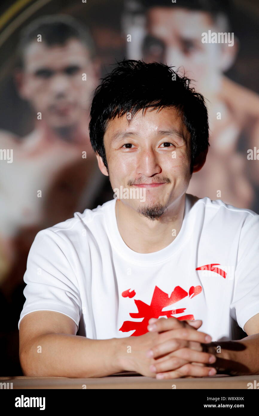 --FILE--Chinese boxer Zou Shiming smiles during a press conference ...