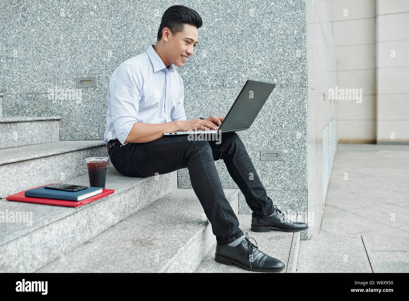 Software developer sitting laptop computer hi-res stock photography and ...