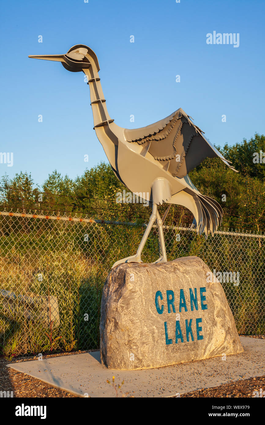 Large sculpture of crane stands at entrance to Crane Lake, a ...