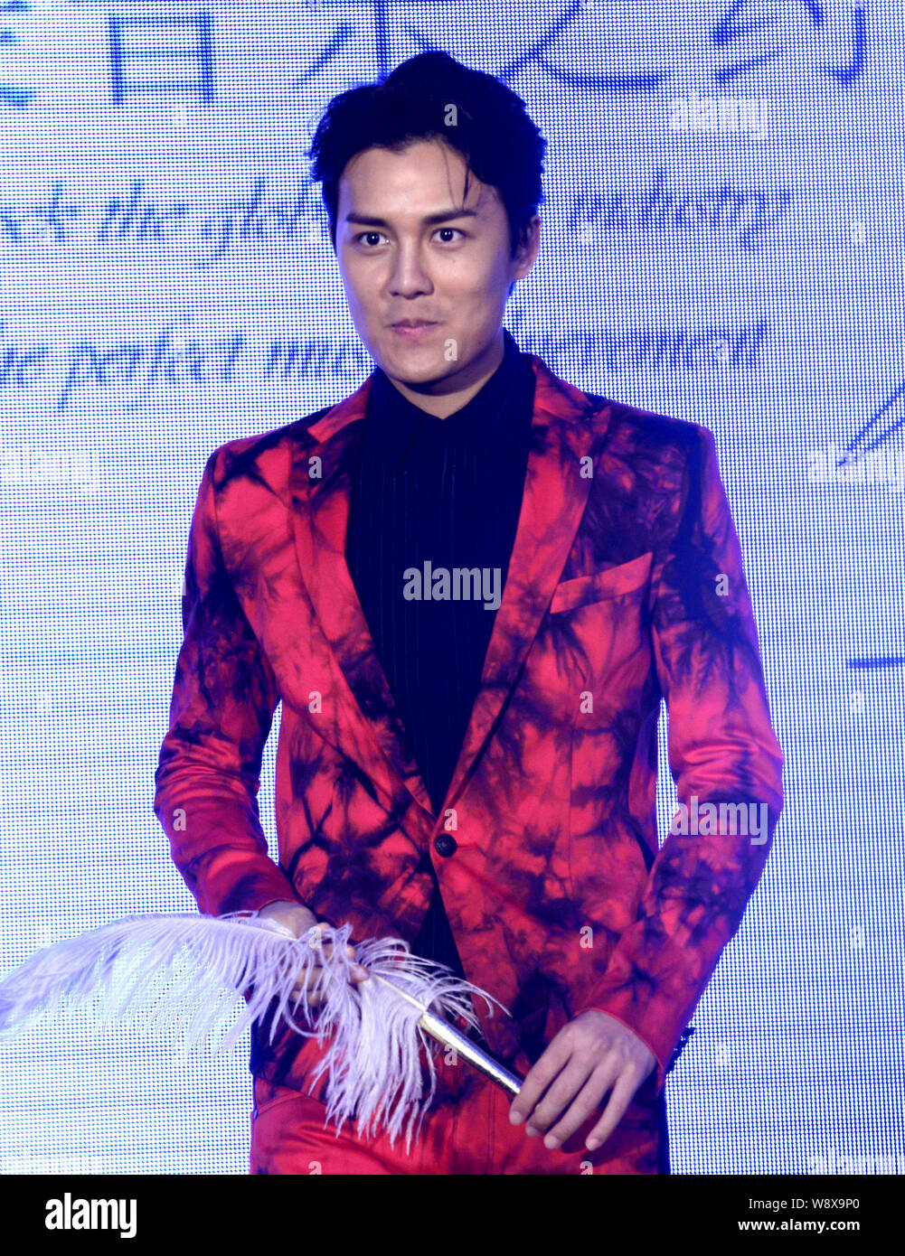 Taiwanese singer Kenji Wu poses during a press conference for joining ...