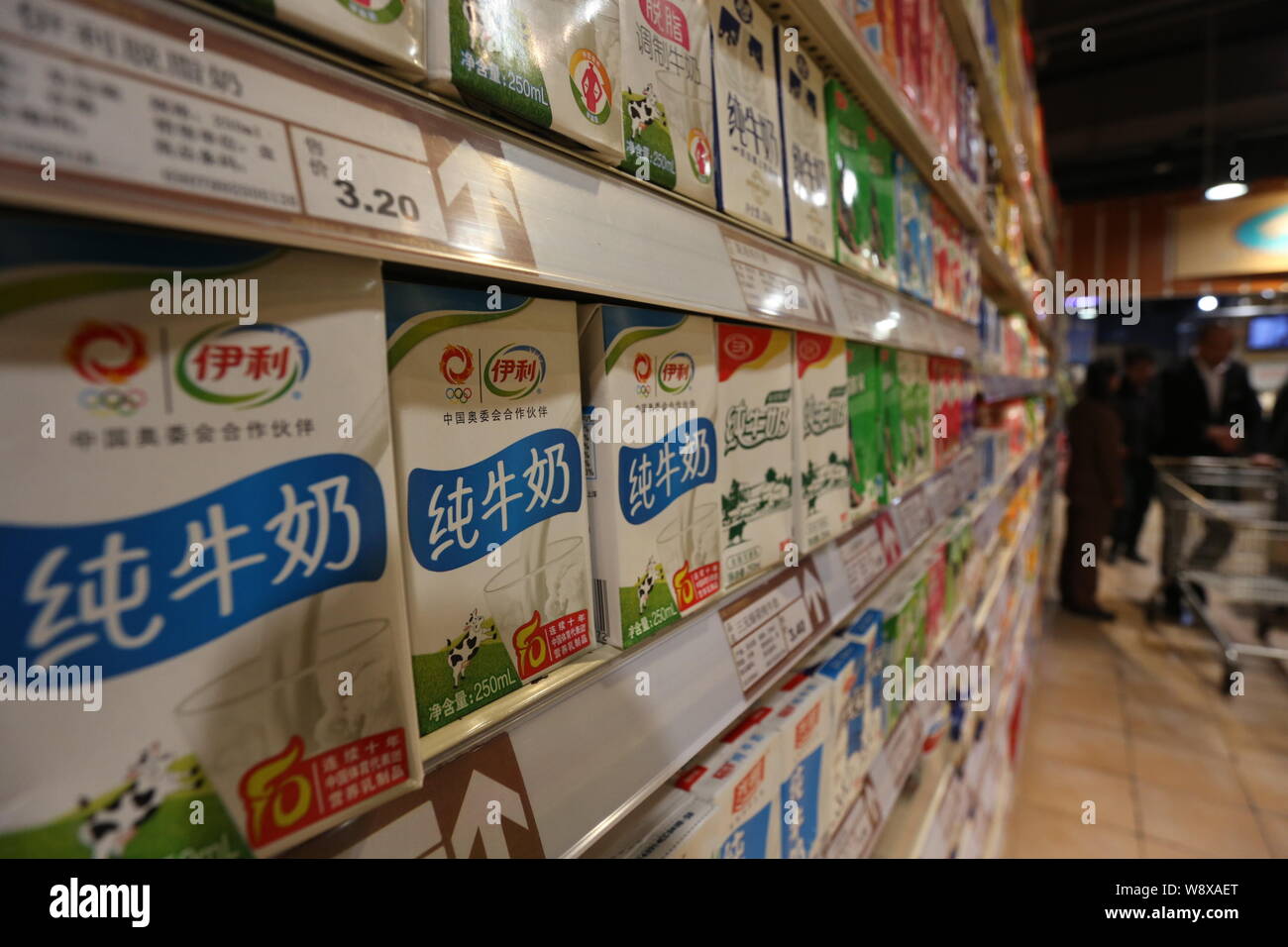 --FILE--Cartons of Yili pure milk are for sale at a supermarket in ...