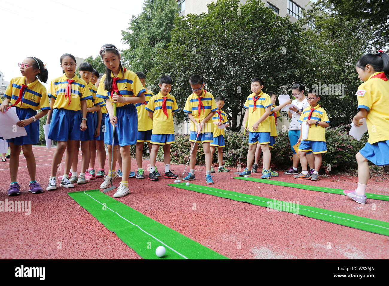 Young Chinese students play golf on the playground at the Hangzhou ...