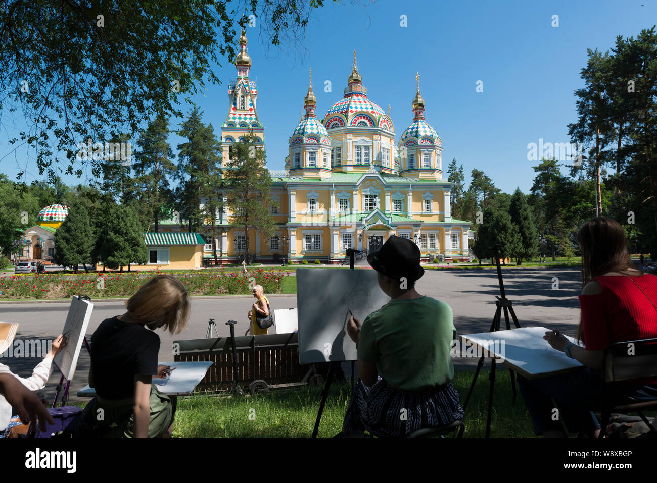Artists drawing the Ascension (Zenkov) Cathedral in Panfilov Park in ...
