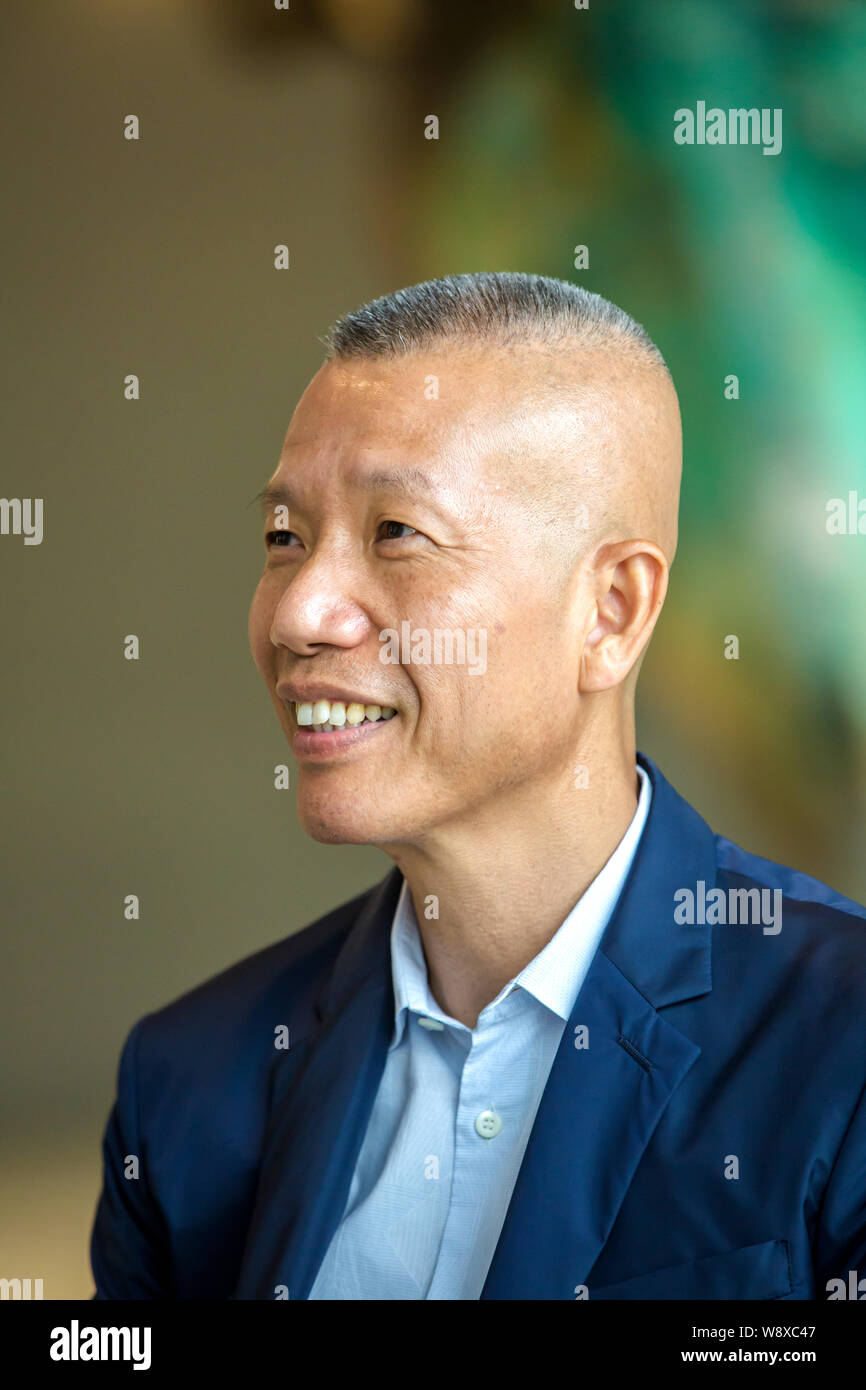 Chinese artist Cai Guoqiang smiles during a press conference for the ...