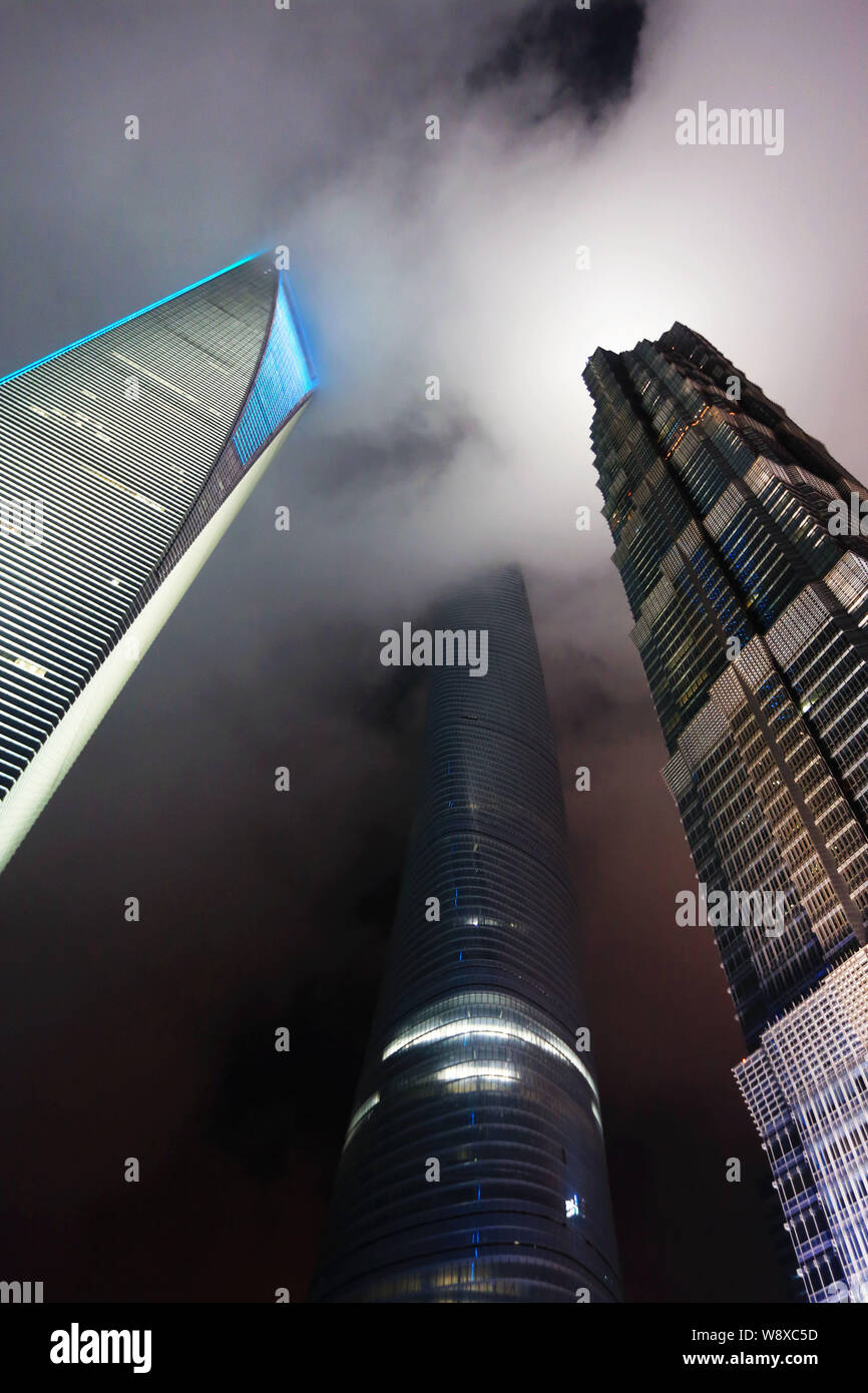 Night view of the Shanghai Tower under construction, center, the ...