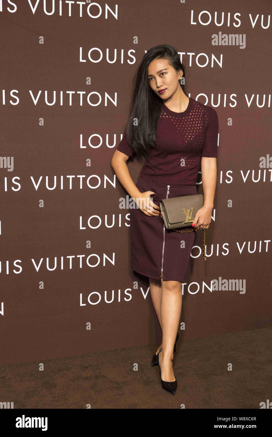 Chinese fashion photographer Chen Man poses as she arrives at the ...