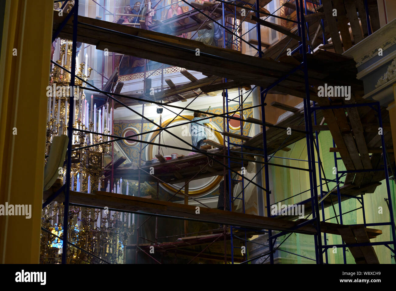 Artist restorig the paintings in the interior of the Ascension (Zenkov ...