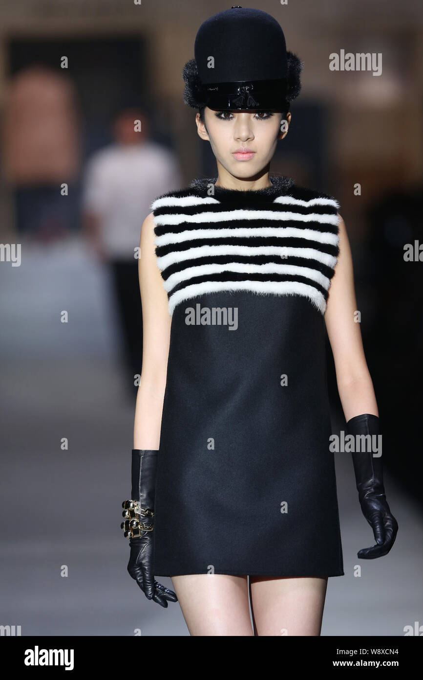 A model displays a new creation designed by Canadian twin brothers Dean ...