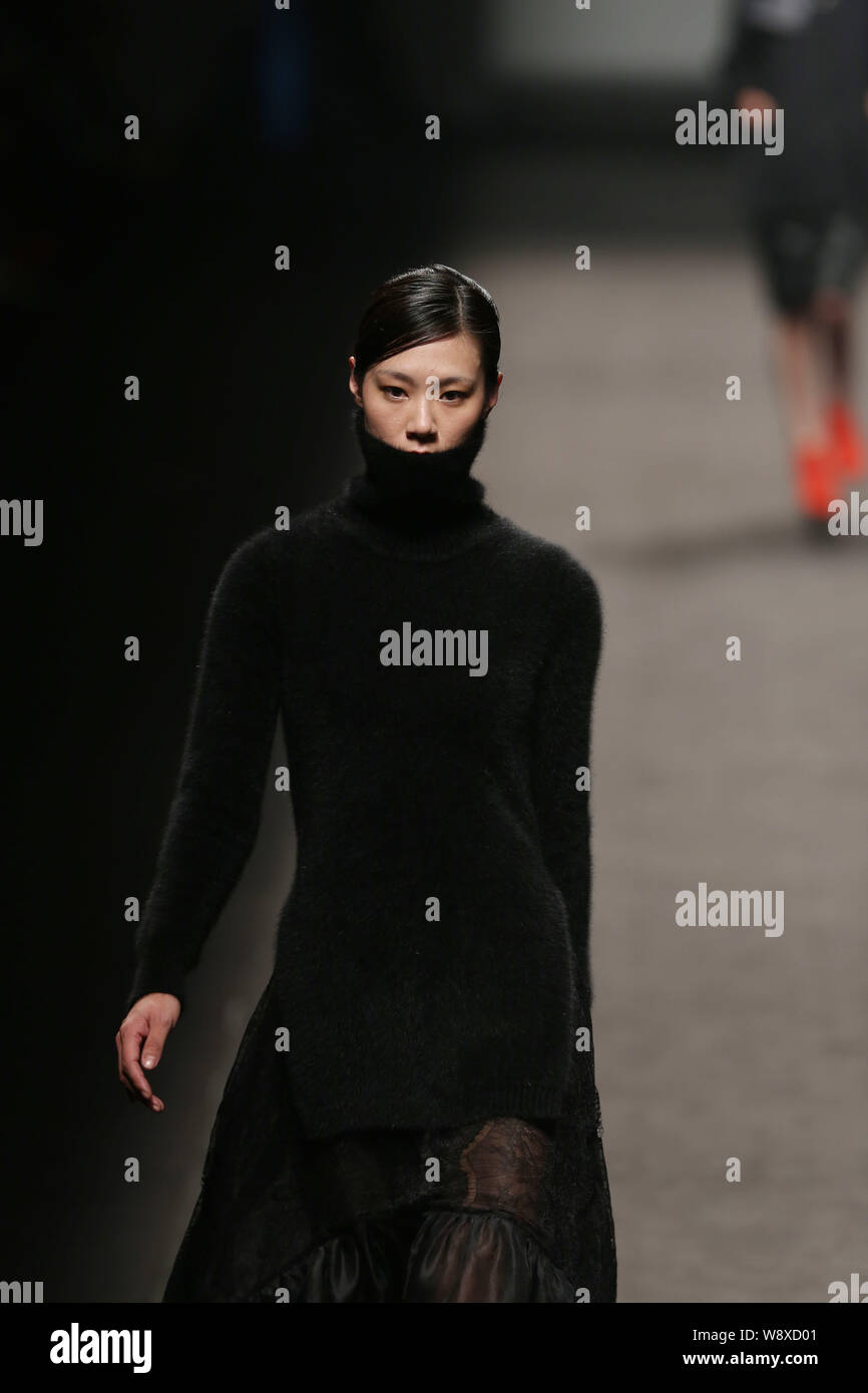 A model displays a new creation at the fashion show of Ji Cheng x sheme ...
