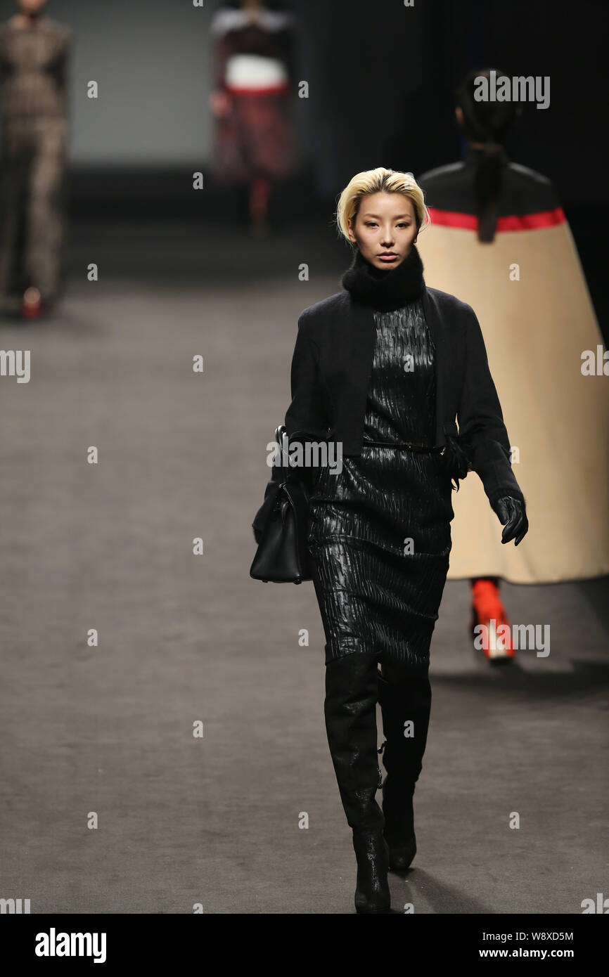 A model displays a new creation at the fashion show of Ji Cheng x sheme ...
